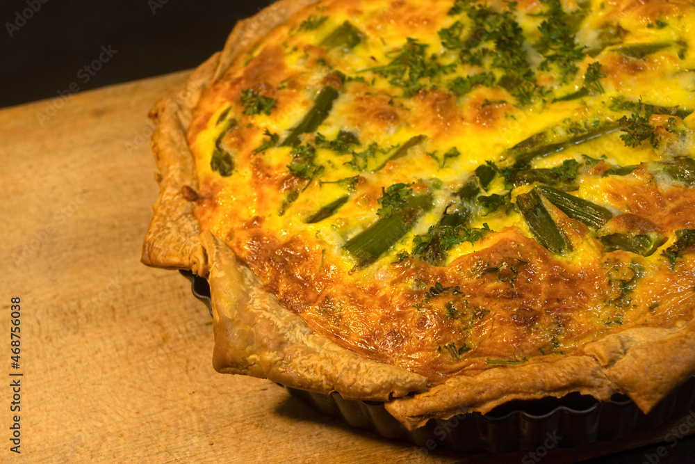 Stock-Foto „Rustic home made savoury tart with shortcrust pastry and an ...