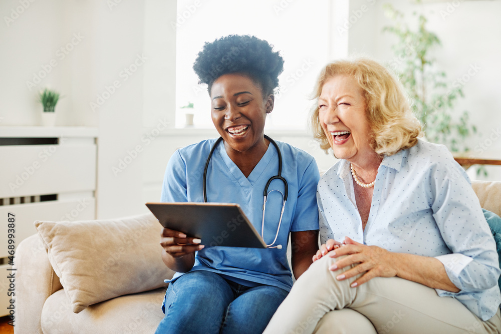 Fotografie nurse doctor senior care tablet computer technology showing ...