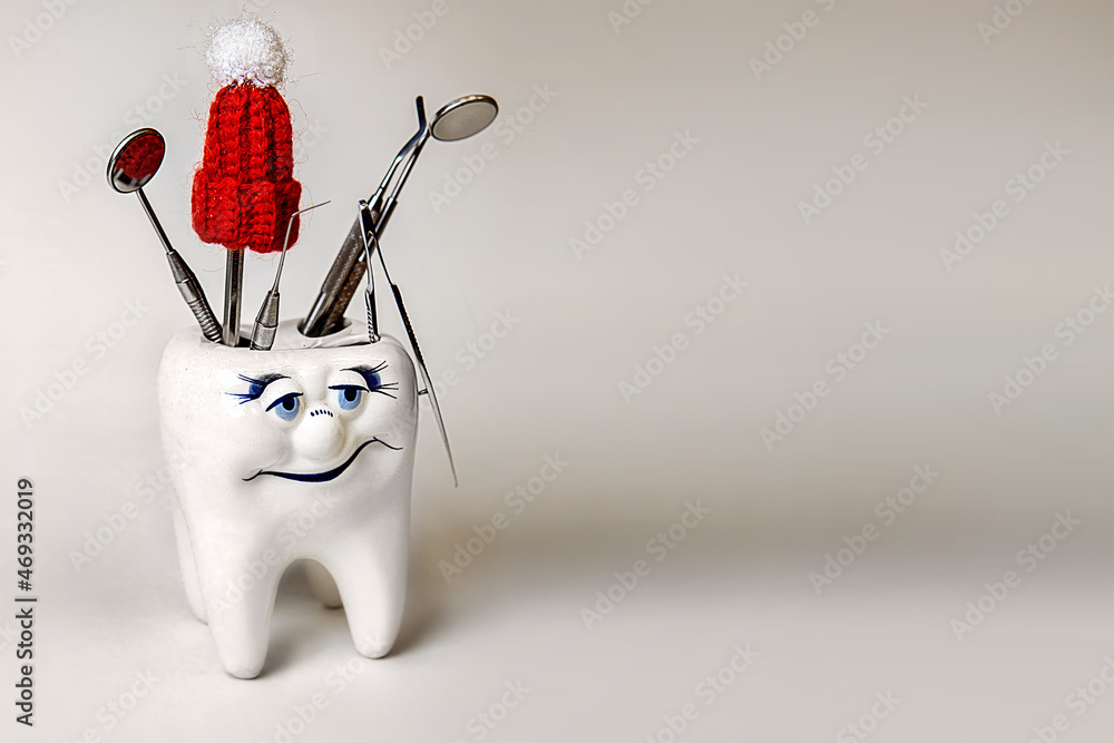 New Year. Christmas. stomatology. a figurine of a tooth in a santa ...