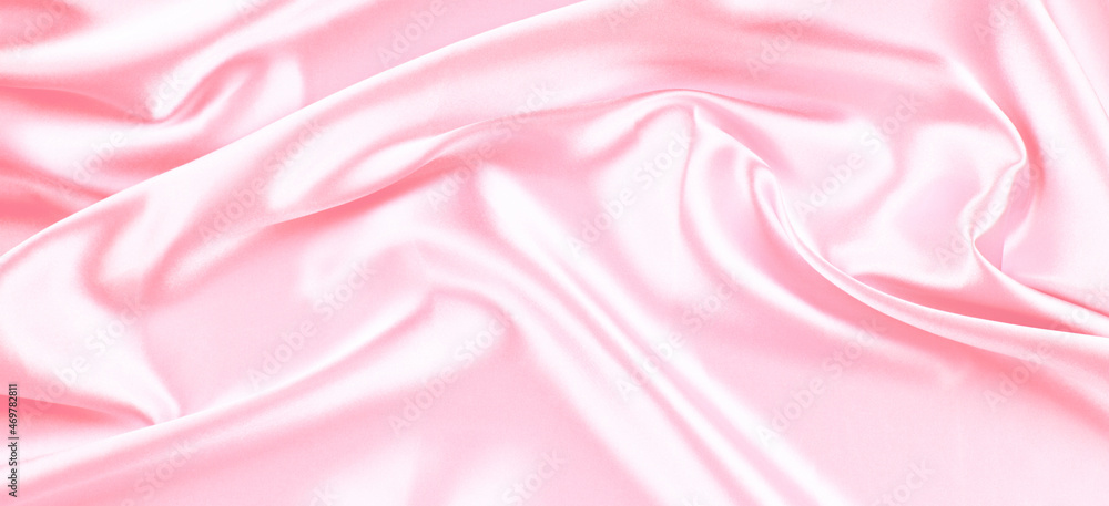 Beautiful pastel pink background with drapery and wavy folds of silk ...
