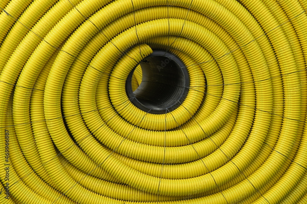 Horizontal Yellow Farm Drainage Tile Rolled into Large Spool Stock ...