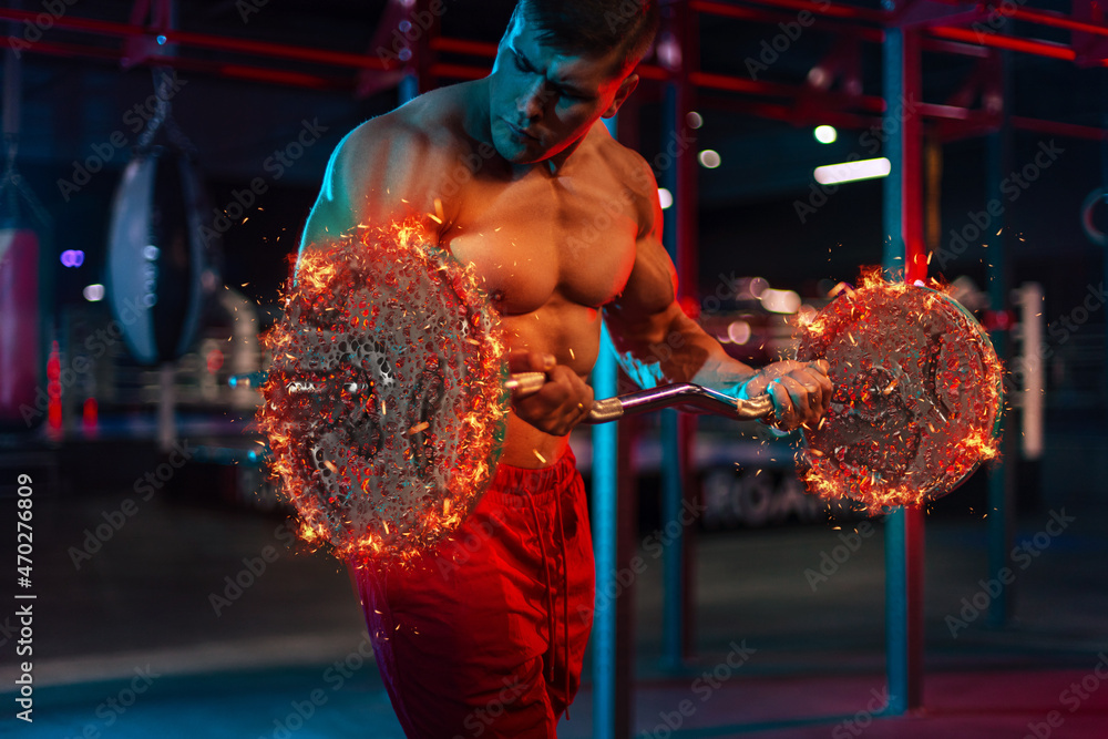 Bodybuilding in the fire. Muscular bodybuilder athlete pumping up ...