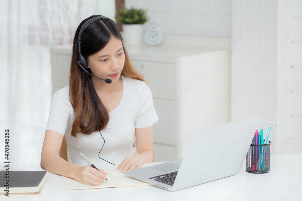 Young asian woman wearing headphone study online with e-learning on ...