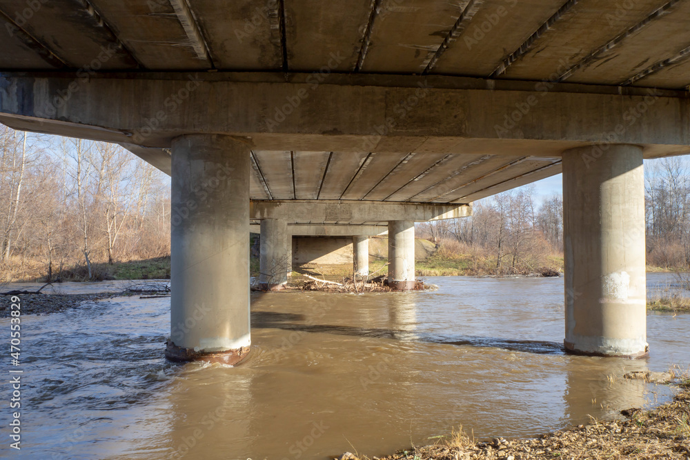 Concrete bridge over the river. Reinforced concrete block bridge ...