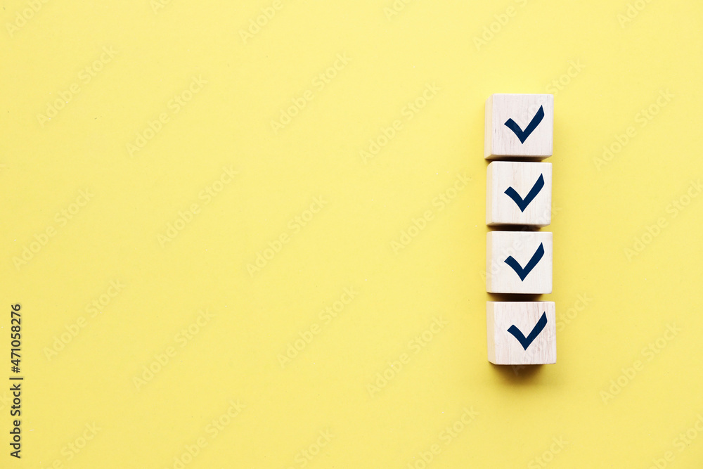 Check mark on wooden cube, checklist concept Stock Photo | Adobe Stock