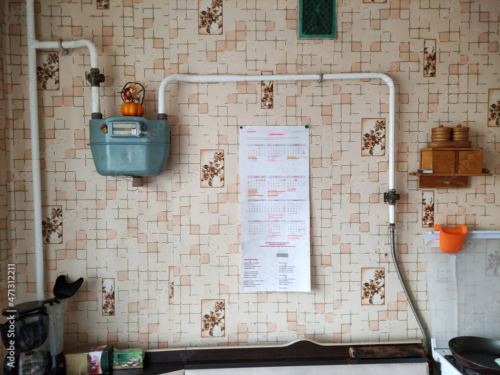 Gas pipe and gas meter in the apartment in a kitchen, home gas ...