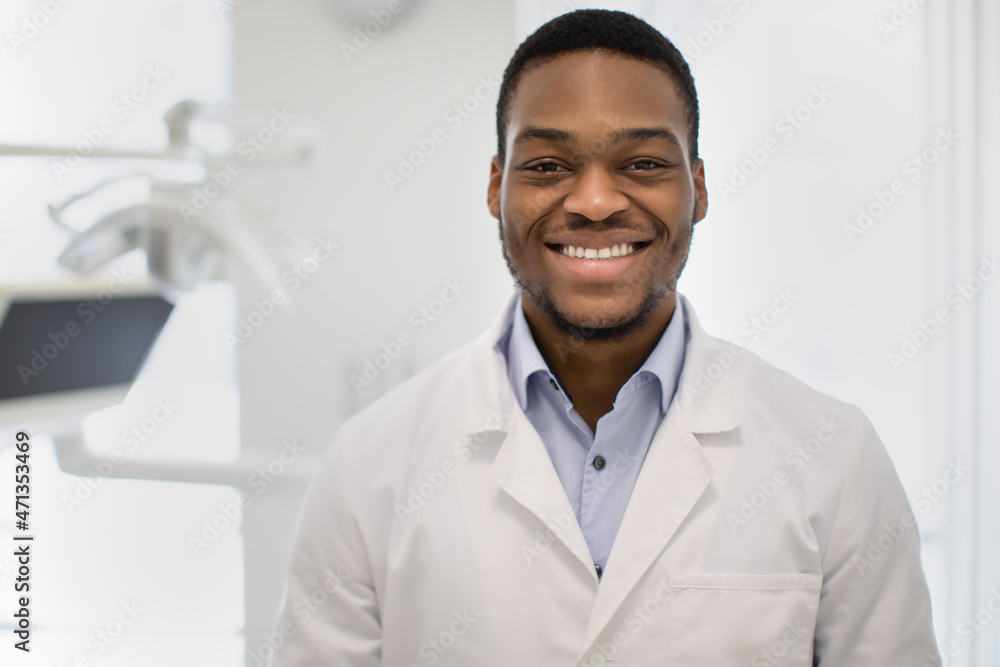 Dentistry Concept. Handsome Black Dentist Man Posing At Workplace In ...