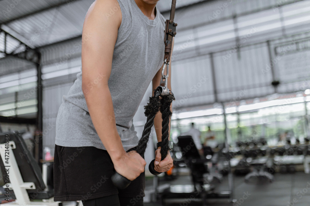 exercise concept The hefty man with his grey sport top and black pants ...