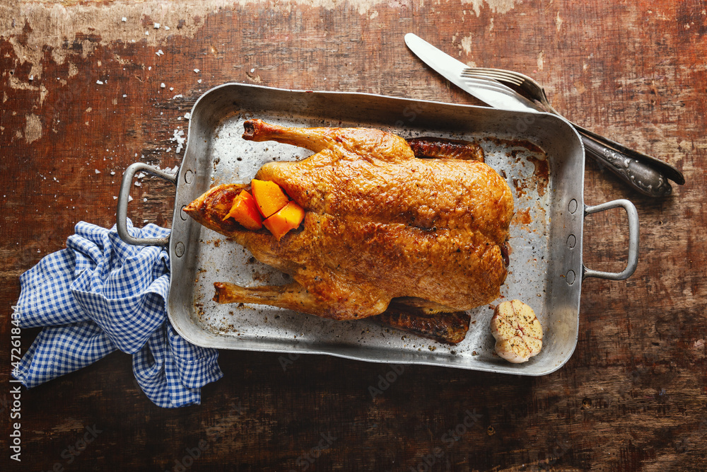 Roasted whole duck with vegetables Stock Photo | Adobe Stock