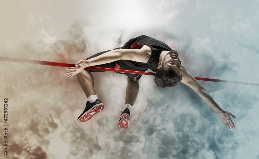 Man in action of high jump. Smoke effect Stock Photo | Adobe Stock