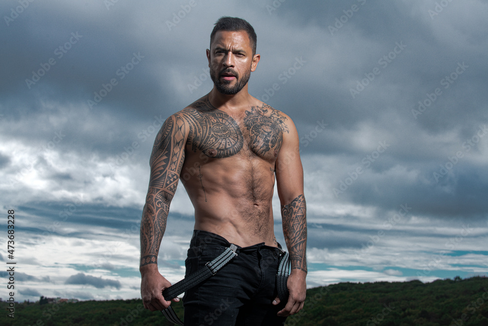 Sexy man with naked torso. Brutal angry gang man lifestyle, serious ...