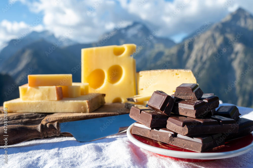 Tasty Swiss cheeses and dark pure chocolate, emmental, gruyere ...