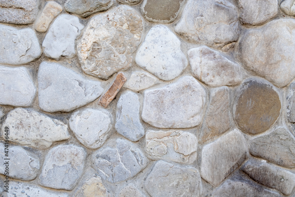 Neatly stacked rough cut stone wall seamless texture background. Stock ...