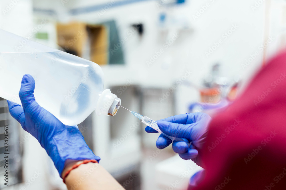 Faceless doctor drawing up syringe Stock Photo | Adobe Stock