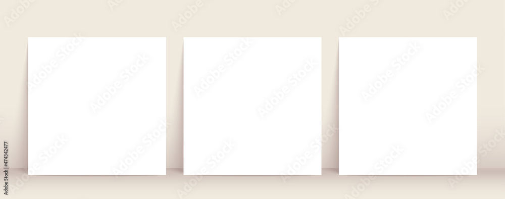 White square posters mockup standing on the floor near beige wall ...