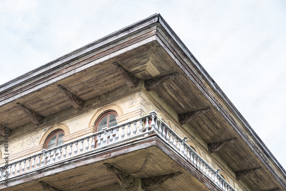 Photo Stock Wraparound balcony and upper corner of historic mansion ...