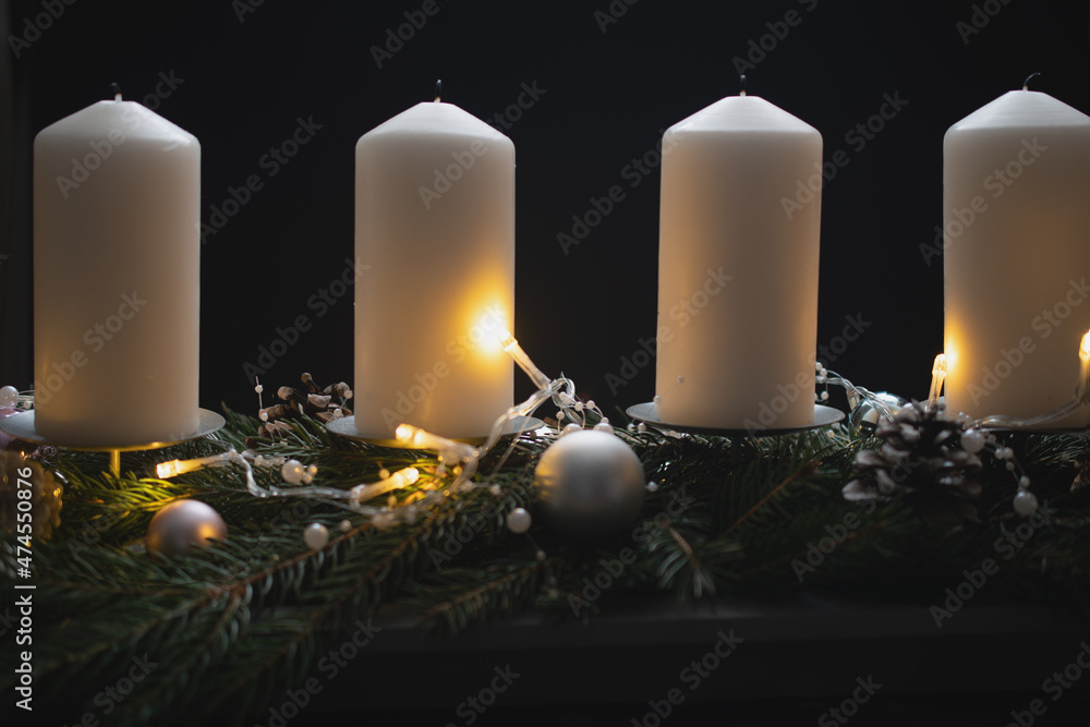 Fourth advent, four candles - candlelight on dark brown panorama ...