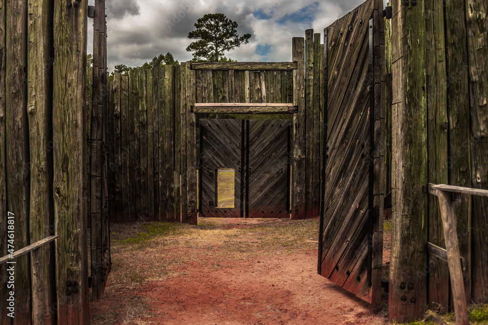 Heavy double doors and palisades reconstructing the fence line which ...