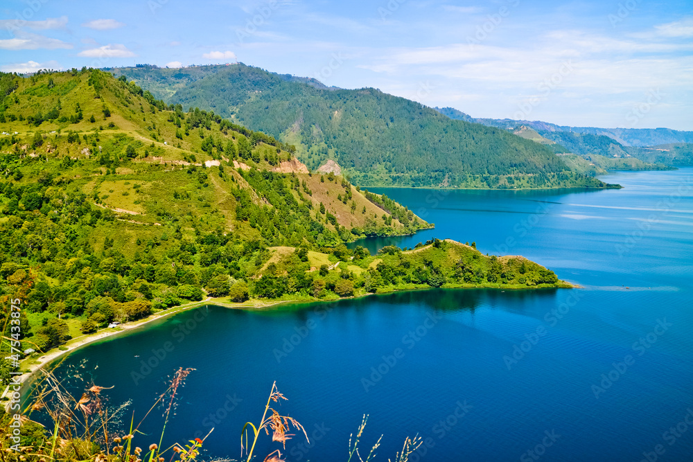 The beauty of Lake Toba which is a caldera lake comes from an ancient ...