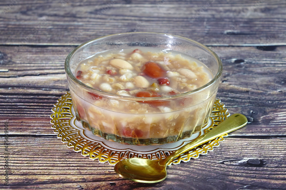 Rice congee made with red beans, lotus seeds, longan, red dates, and ...