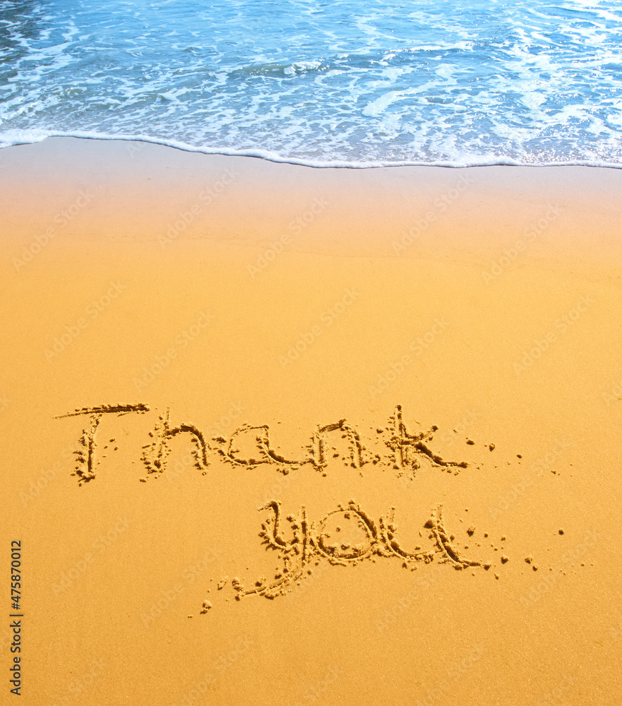 Thank you written in the sand on the beach. Stock Photo | Adobe Stock