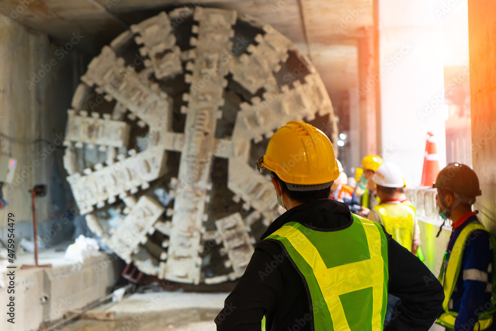 Engineer wear yellow helmets,vests safety are discussing.Technician ...