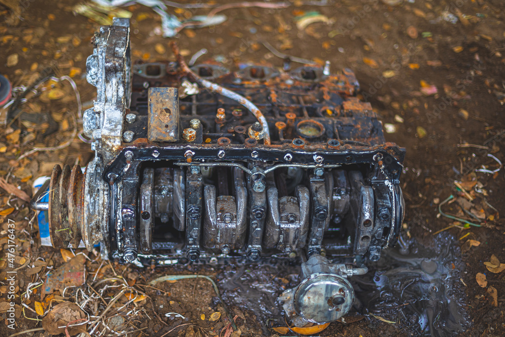 Broken engine parts waiting to be recycled in a waste recycling center ...