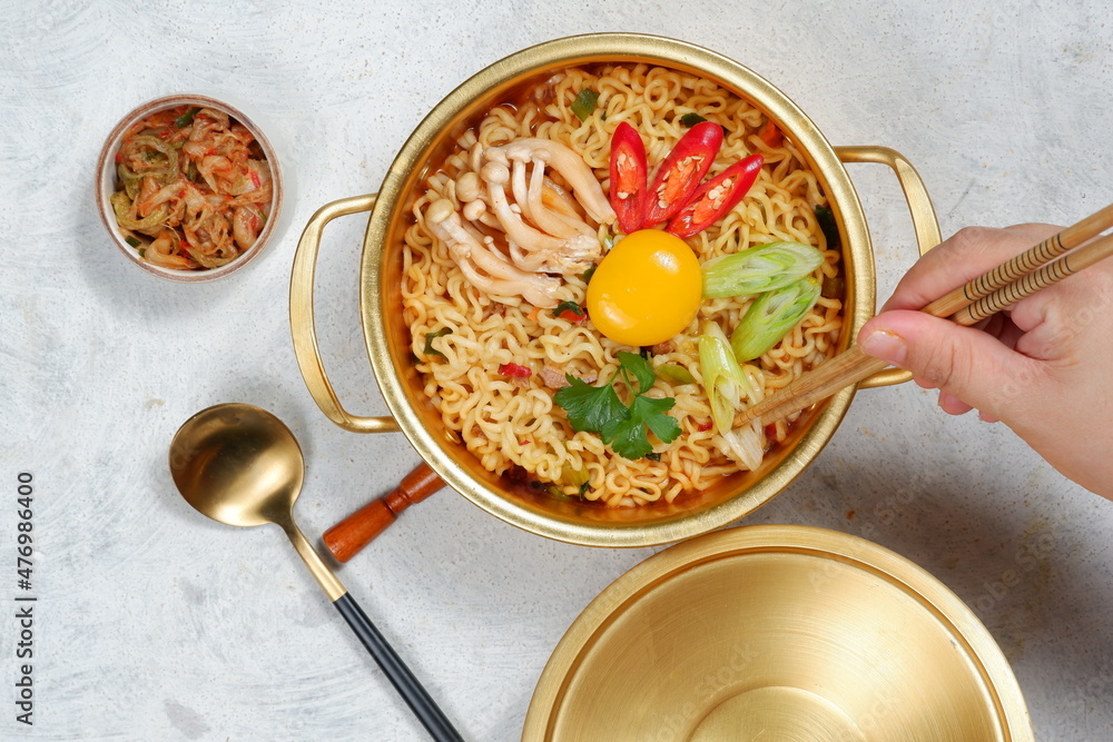 Serving a Korean style instant noodle, Ramyeon or Ramyun with spicy ...