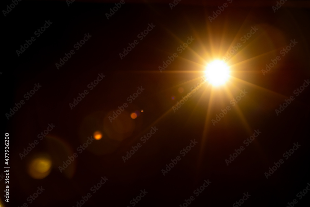 Sun flare on the black background Stock Photo | Adobe Stock
