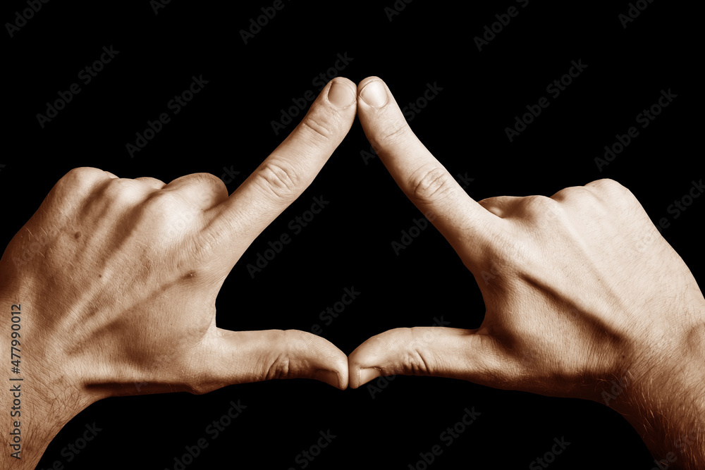 Triangle shape made with fingers. Two hands connected together ...