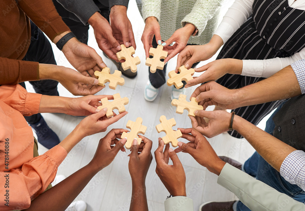 Business and cooperation. Multiracial people stand in circle and ...
