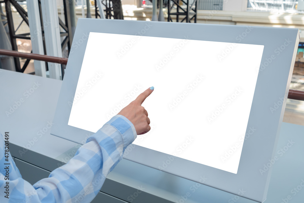 Woman hand touching blank interactive touchscreen white display of ...