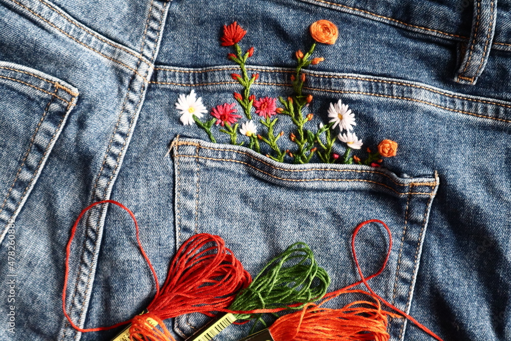 Creative DIY project, hand embroidery at home on jeans, creative hobby ...