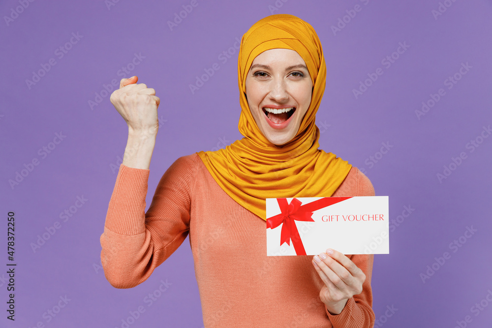 Young arabian asian muslim woman in abaya hijab yellow clothes hold ...