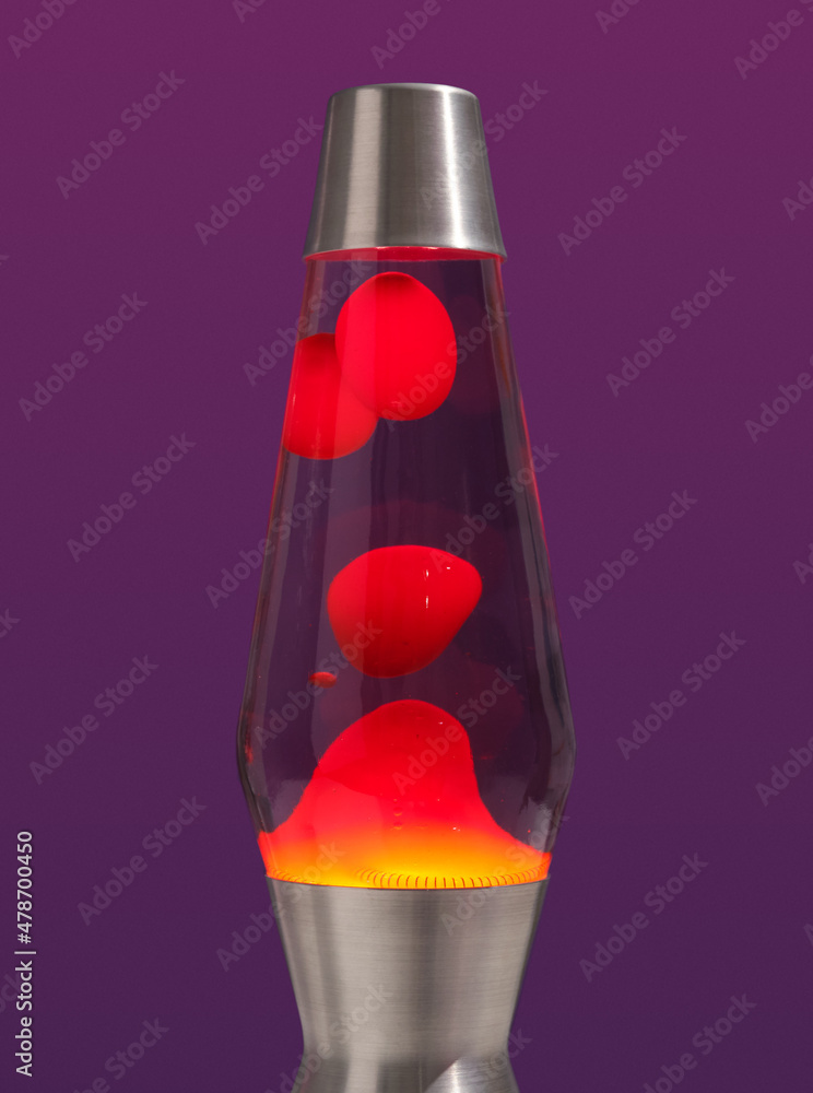 Retro lava lamp on dark purple background. Unique and calming traceries ...