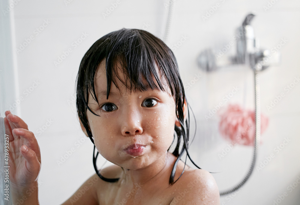 Cute Asian little girl playing in the bath Stock Photo | Adobe Stock