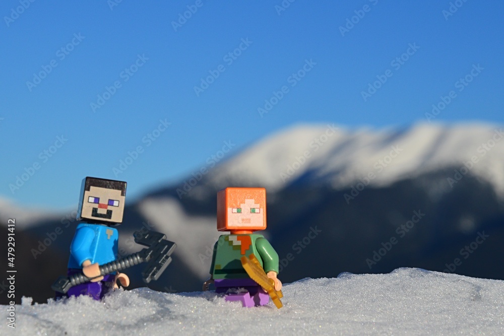 LEGO Minecraft figure of Steve with iron pickaxe and Alex with golden ...