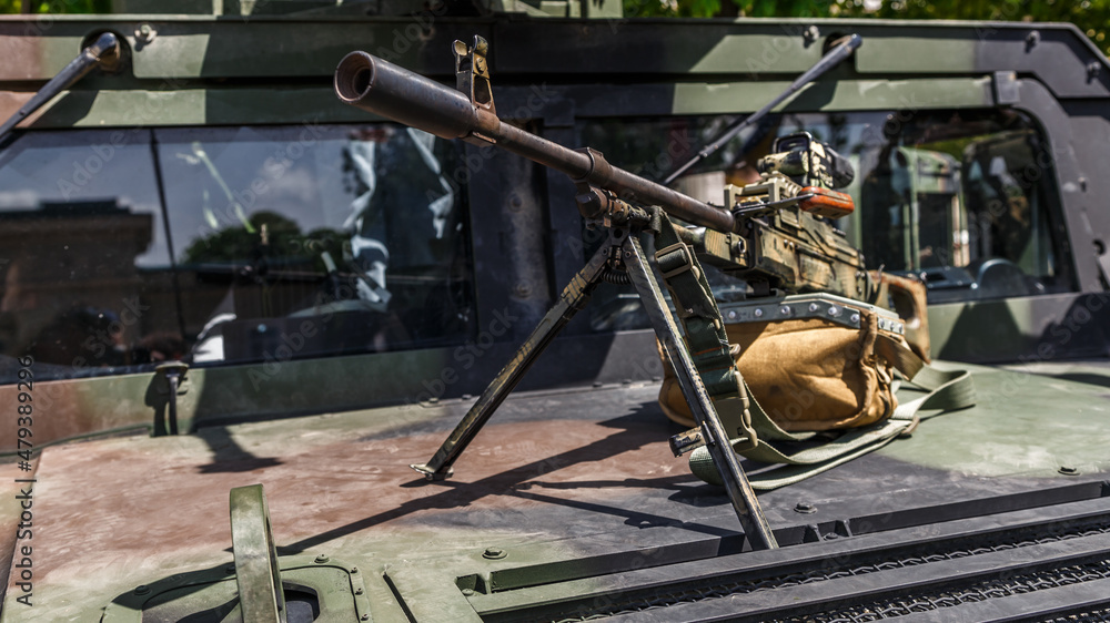 Machine gun Kalashnikov on the tripod and optical sight.M249 light ...