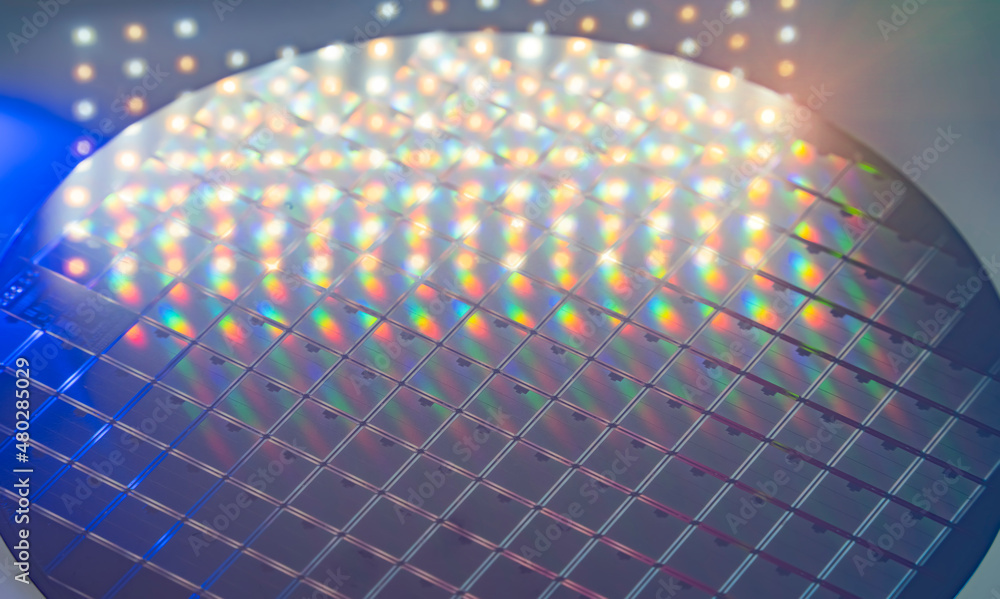 Silicon Wafers with microchips used in electronics for the fabrication ...