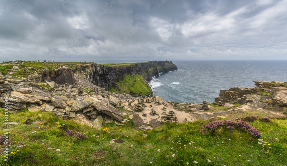 Panorama with rock balancing or stone stacking on the edge of iconic ...