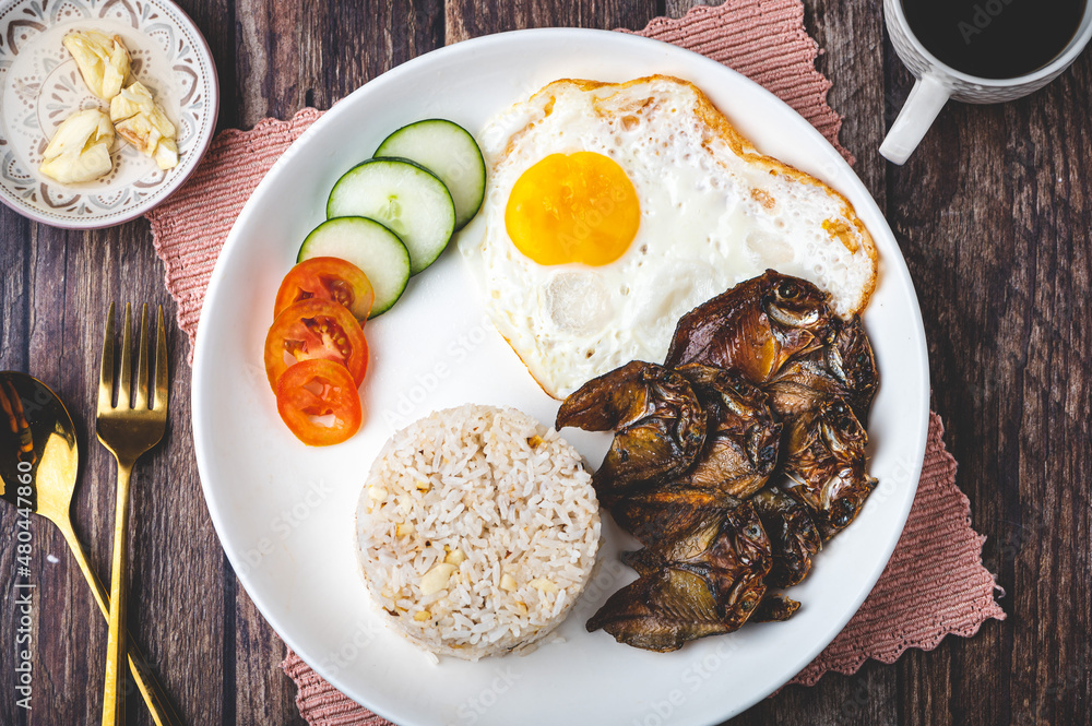 Danggitsilog- is a famous Pinoy breakfast combination of fried Danggit (dried fish), egg, and ...