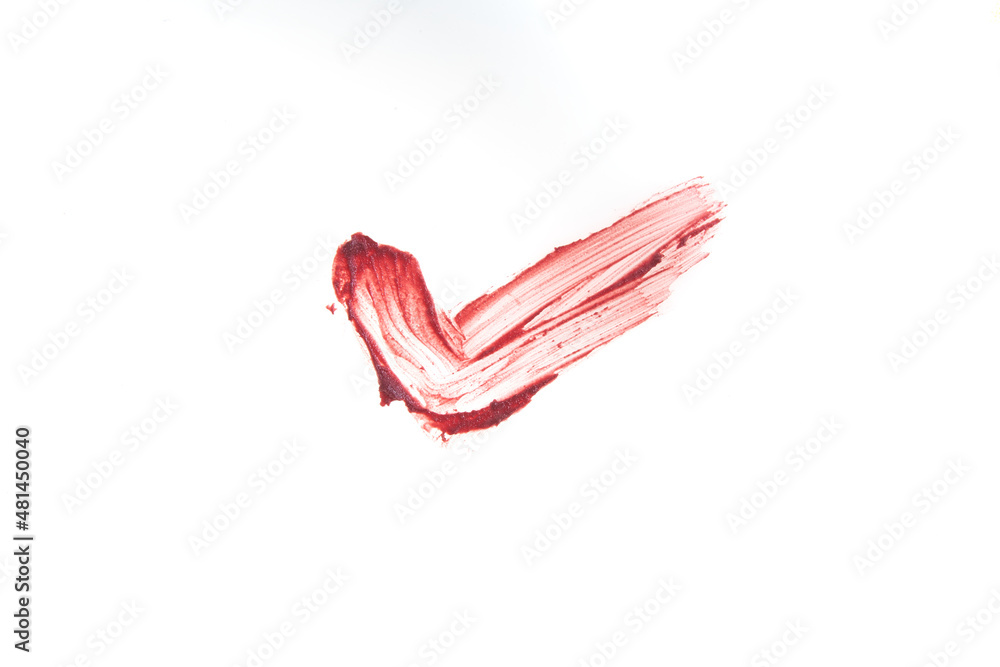 In the form of a tick, a smear of lipstick texture for lips. The red ...