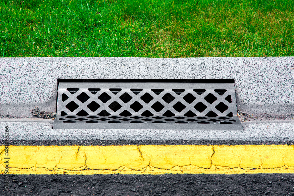 Photo Stock gray gutter of a stormwater drainage system on the side of ...