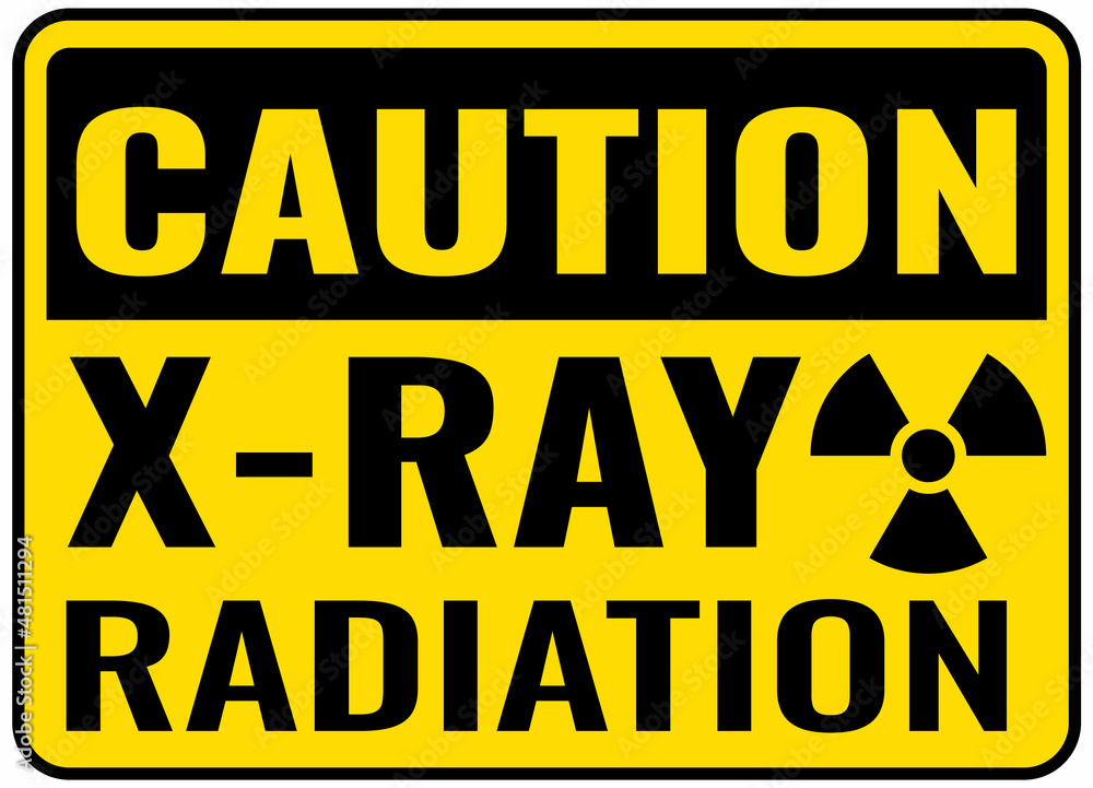 Caution X-Ray radiation sign. Yellow, Black background warning label ...