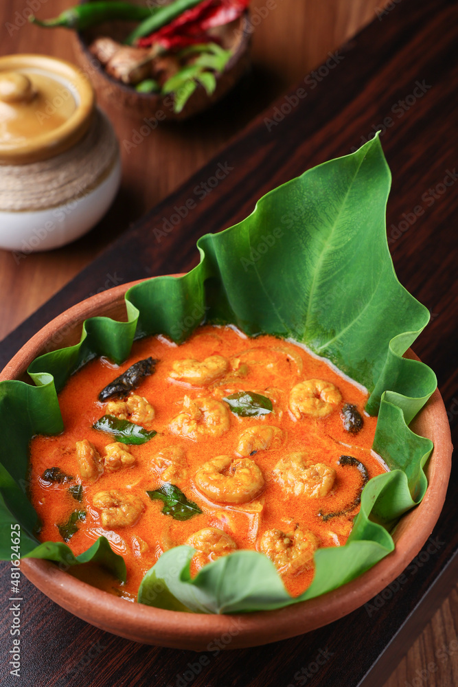 Serving Shrimp masala fish curry Chemmeen curry in coconut milk tiger ...