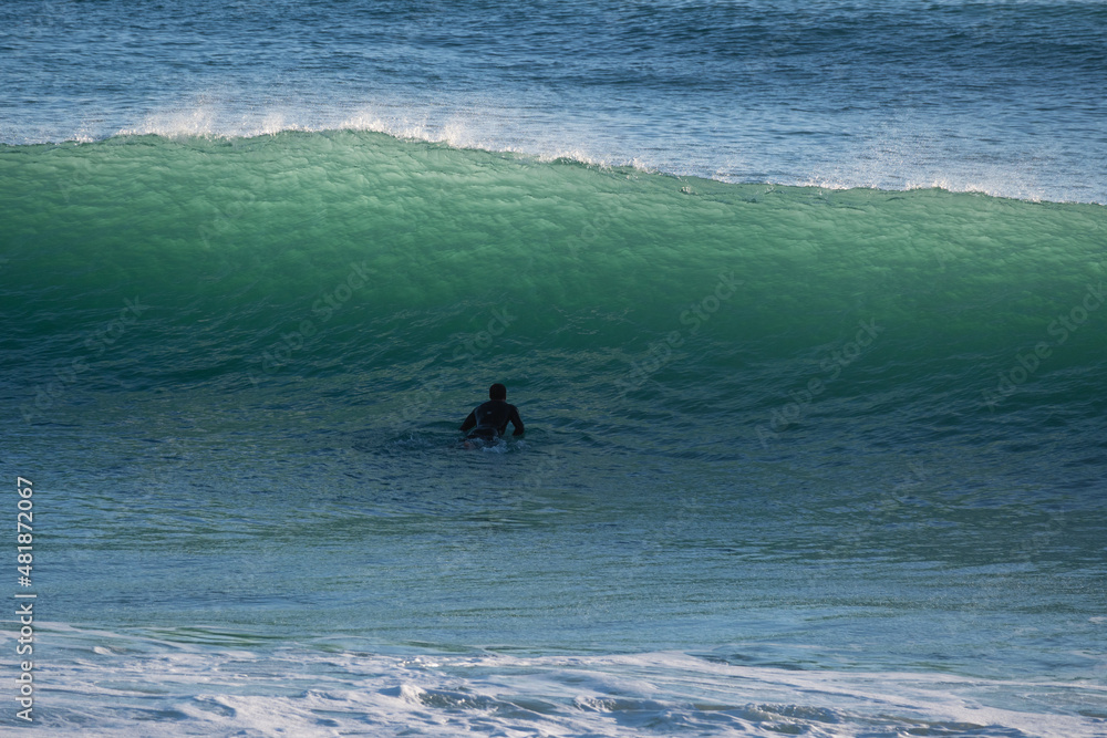Surfer in front of big breaking Atlantic waves in Caños de Meca ...