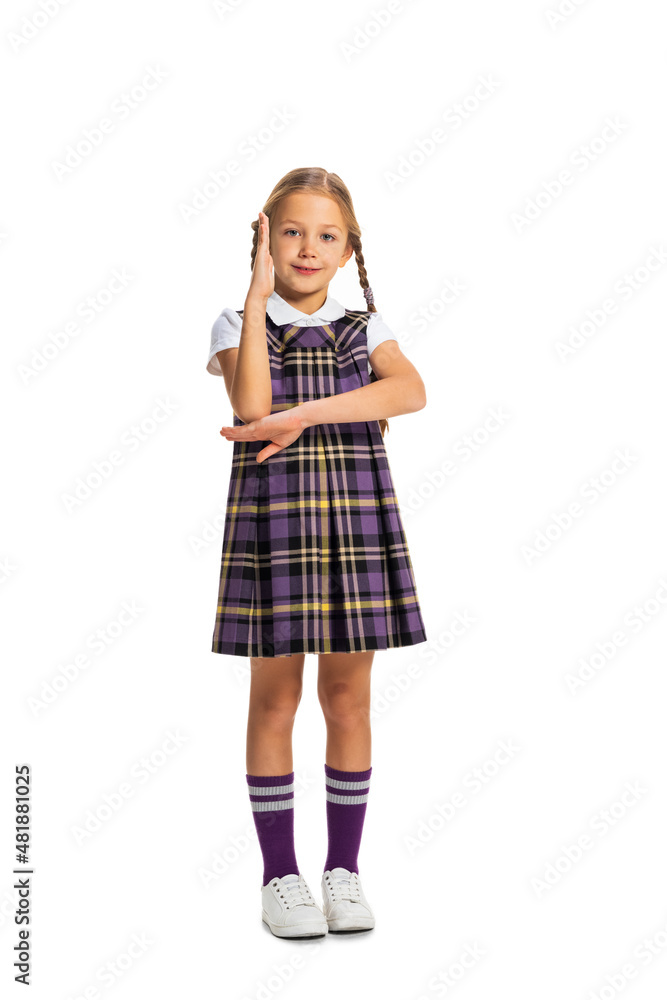 Portrait of cute child, little girl, pupil in school uniform posing ...