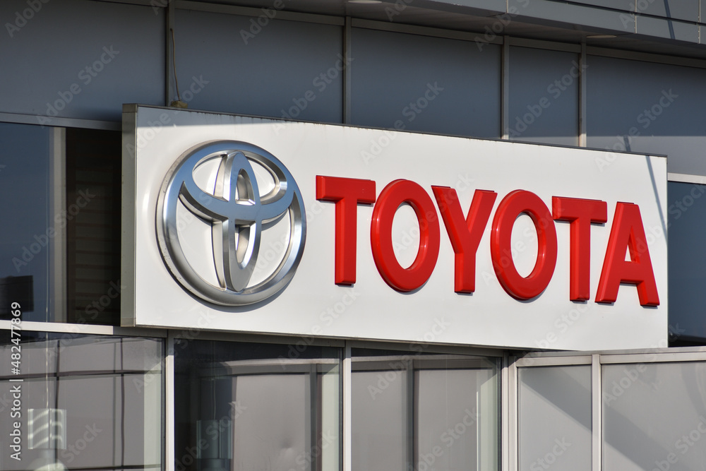 Toyota sign, logo, symbol on the facade of the Toyota Okecie building ...