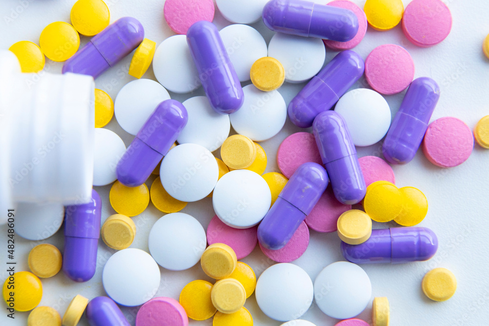 Tablets of different types and colors, tablets fell out of the ...