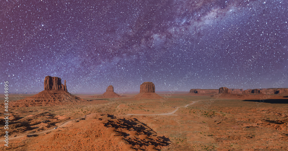 Amazing starry night over Monument Valley, USA. Aerial panoramic view ...